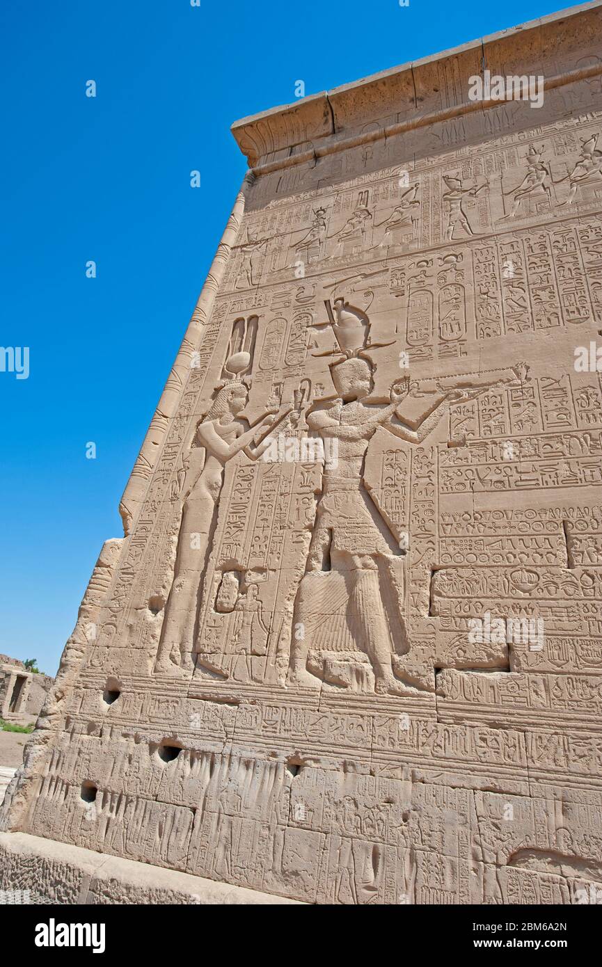 Hieroglypic carvings on wall at the ancient egyptian temple of Hathor ...