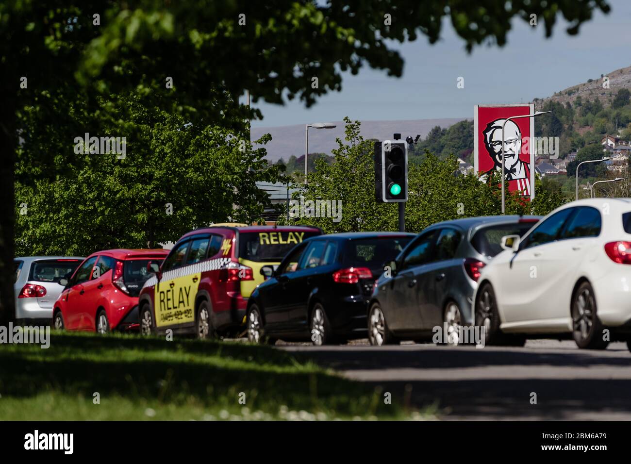 MERTHYR TYDFIL, WALES - 07 MAY 2020 - Cars queue for a long awaited KFC ...