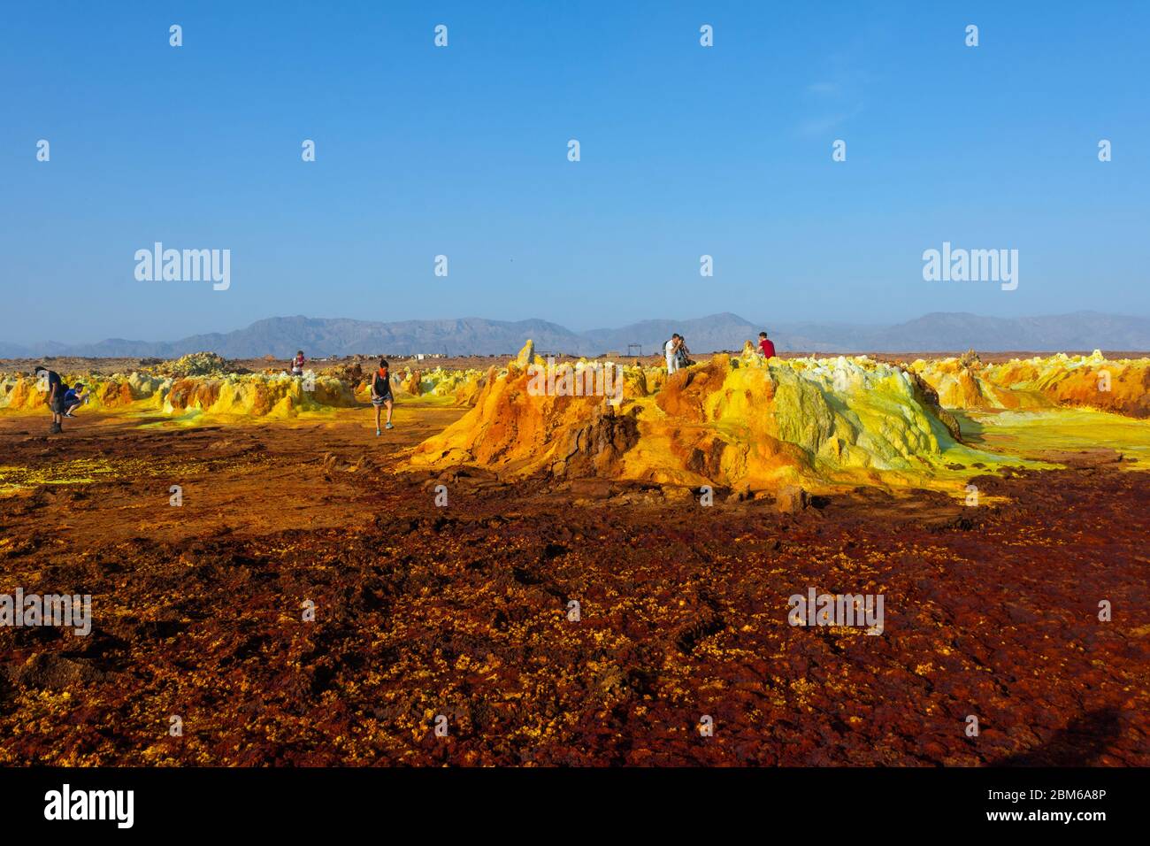 Dallol, Ethiopia - Nov 2018: Tourists passing thru colorful landscape ...