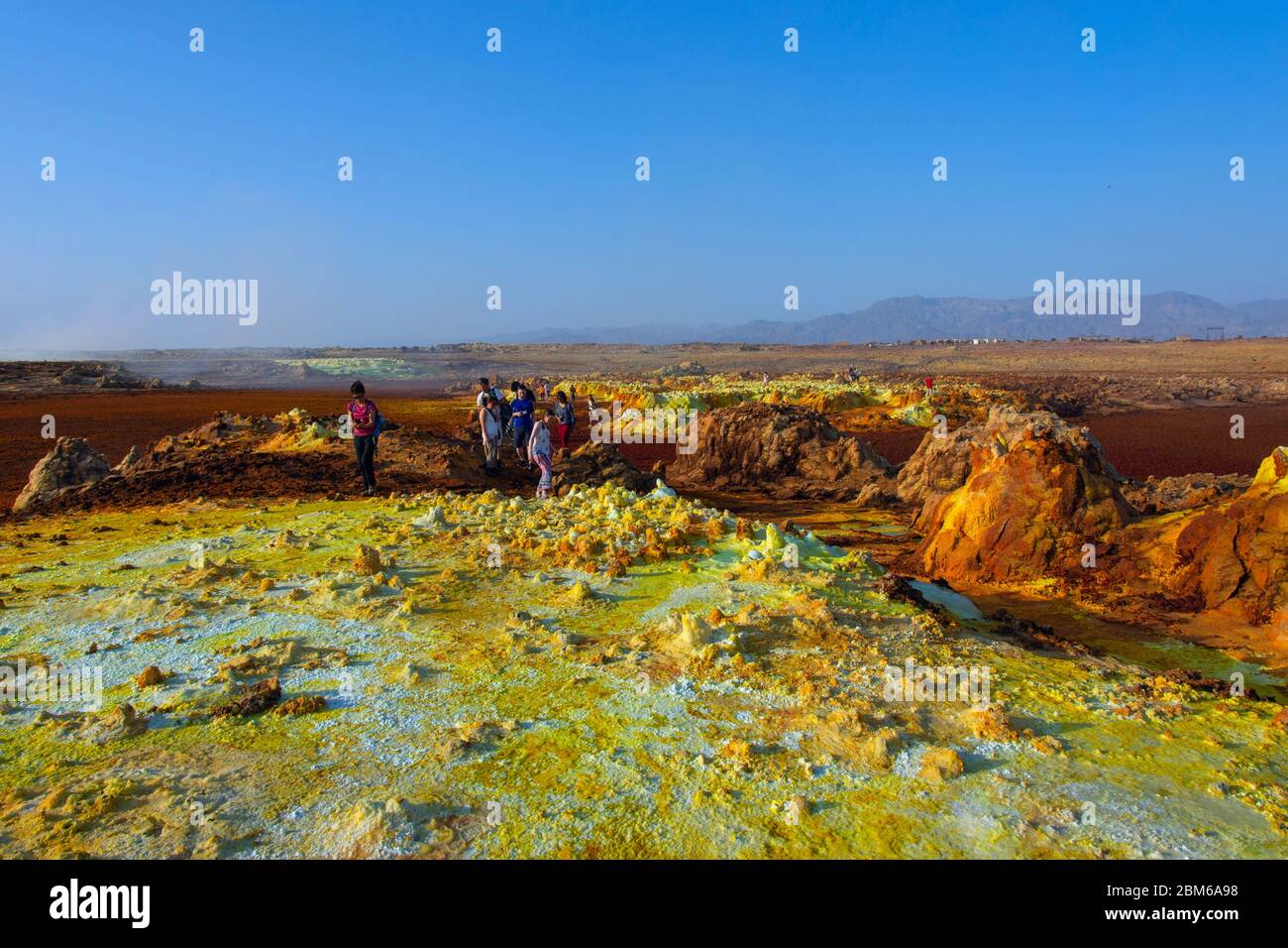 Dallol, Ethiopia - Nov 2018: Tourists passing thru colorful landscape ...
