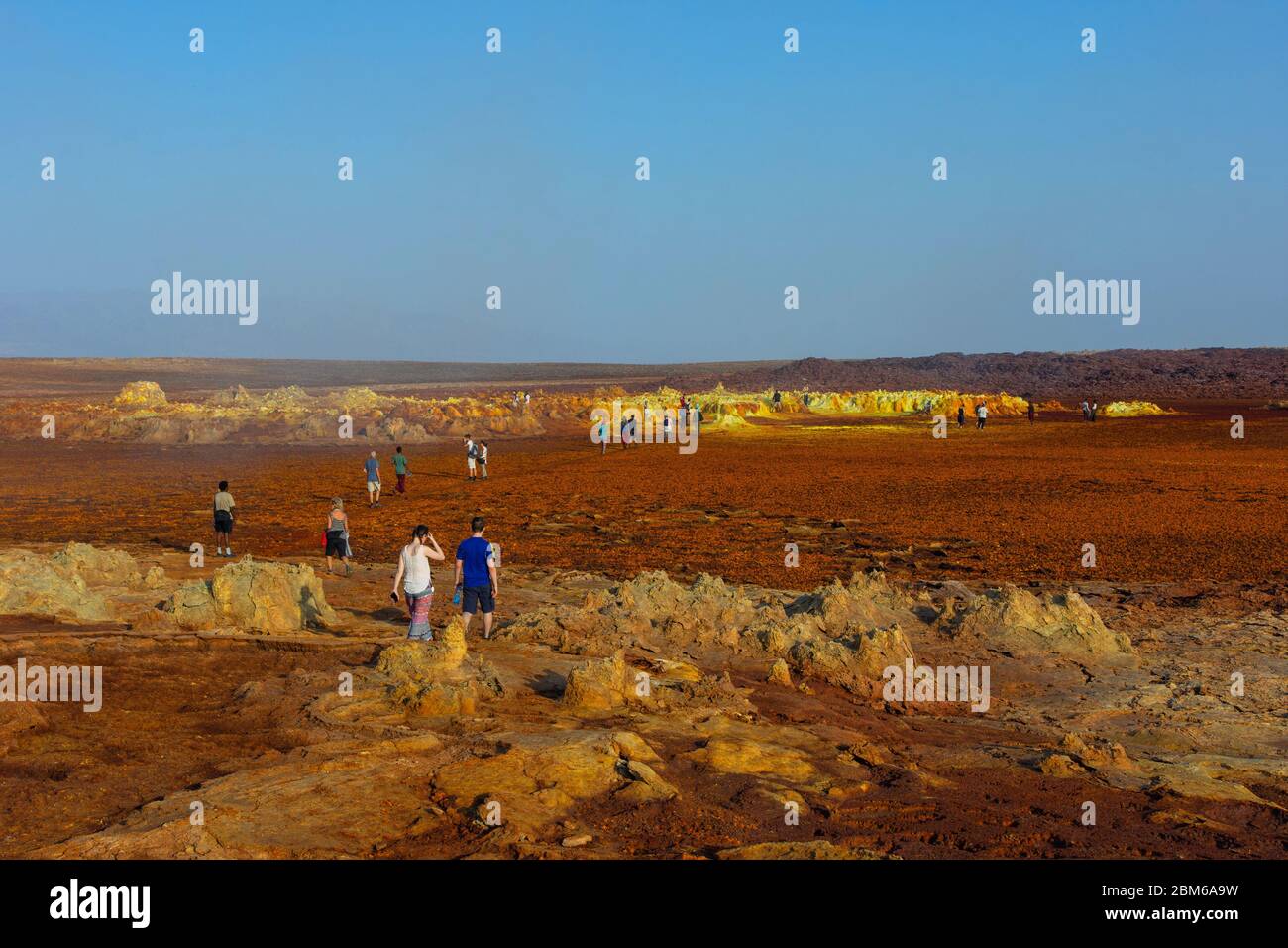Dallol, Ethiopia - Nov 2018: Tourists passing thru colorful landscape ...