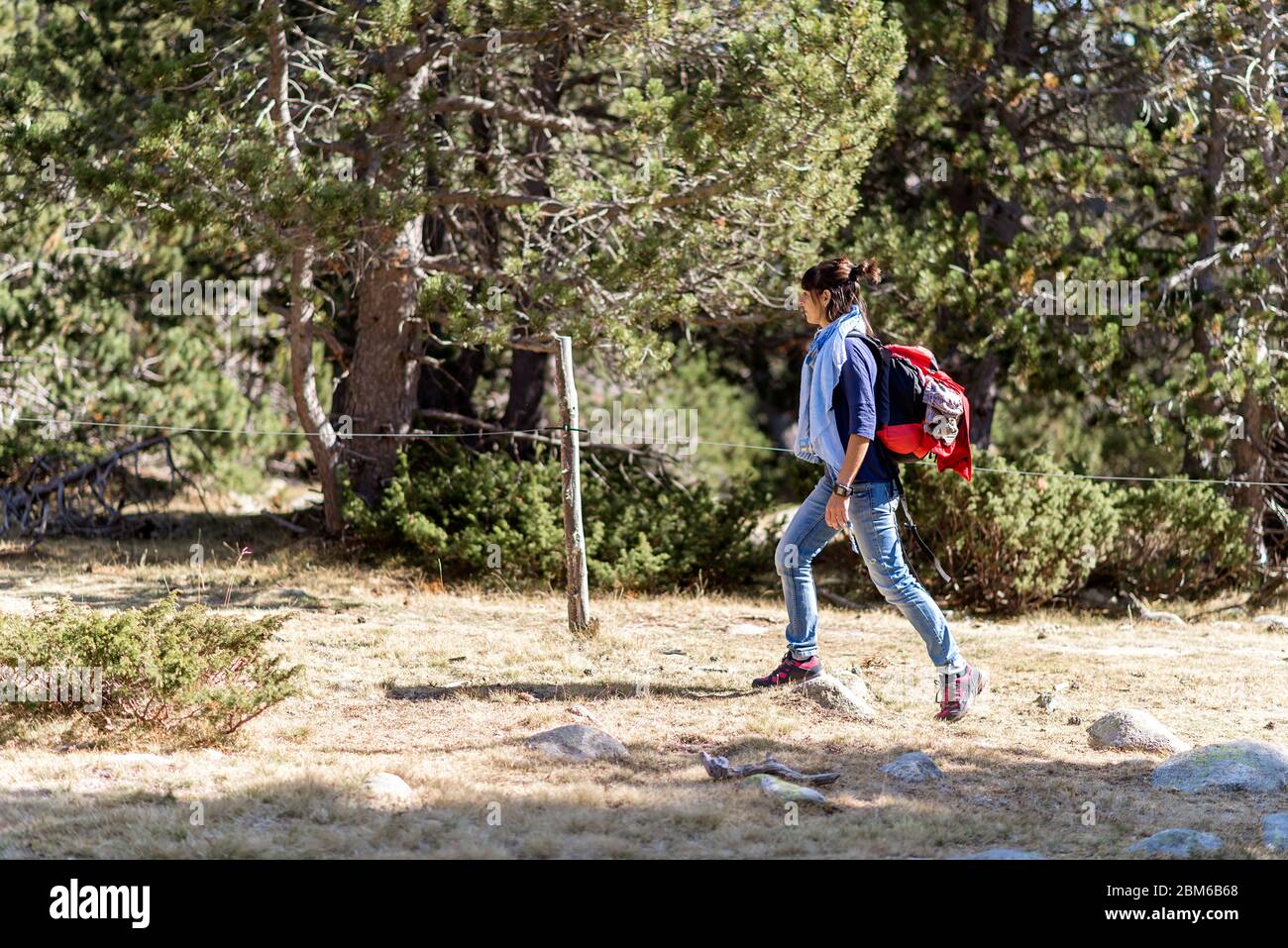 Side view female backpacker hiking hi-res stock photography and images ...