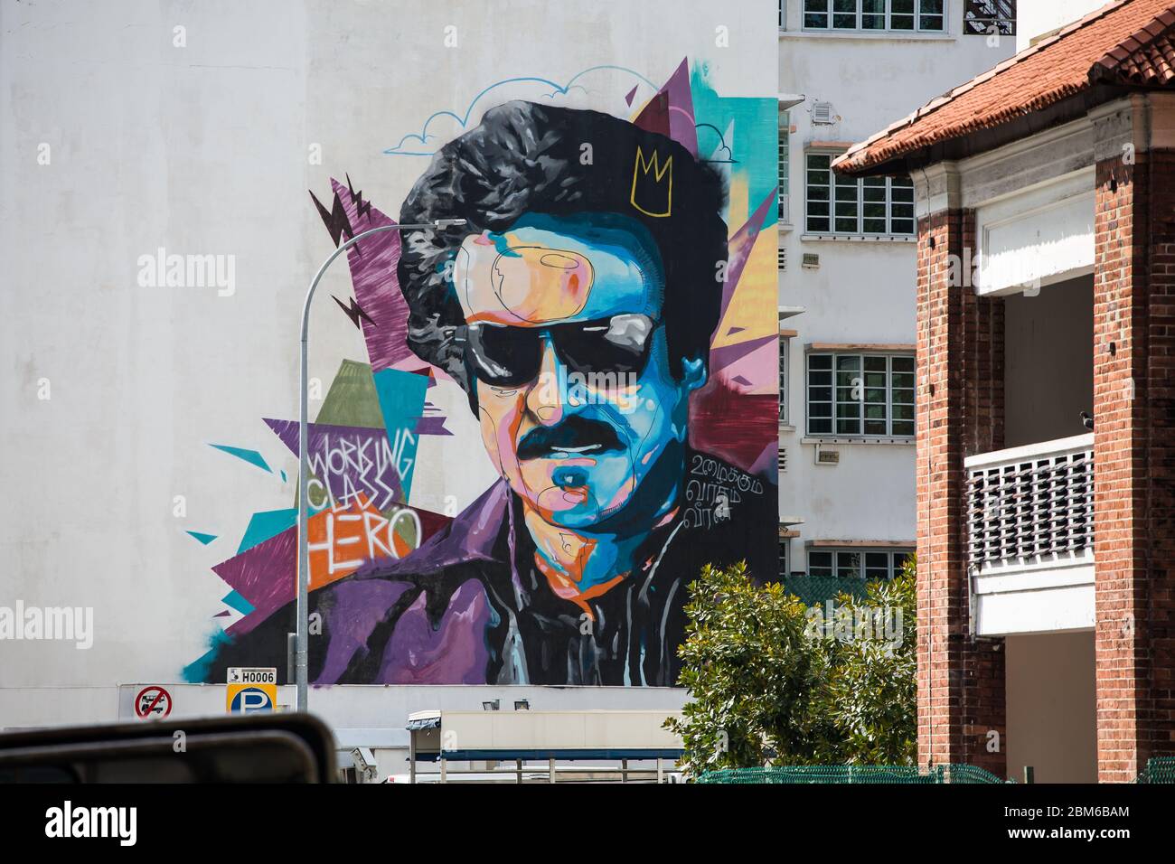 A huge colourful drawing of a handsome Indian man on a building ...