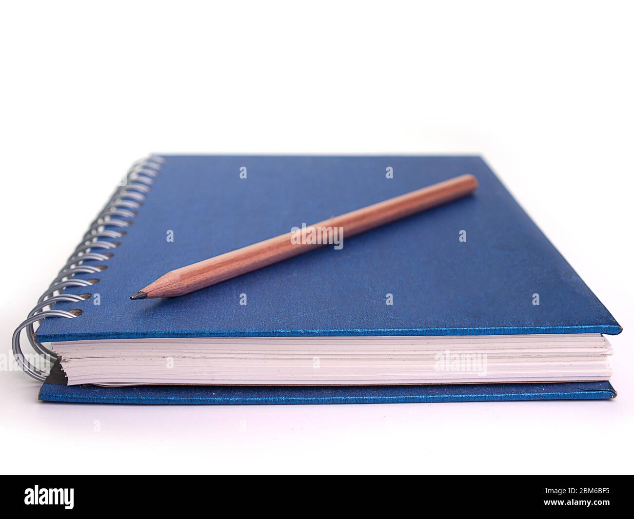 closeup notebooks and pencil ,Put on a white background Stock Photo - Alamy