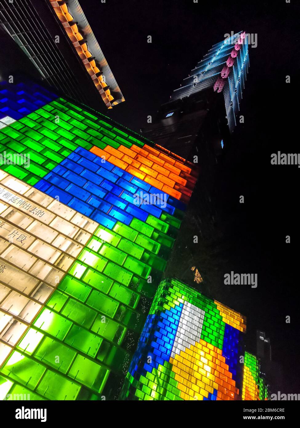 City of neon brick looking lights in yellow orange blue green white in ...