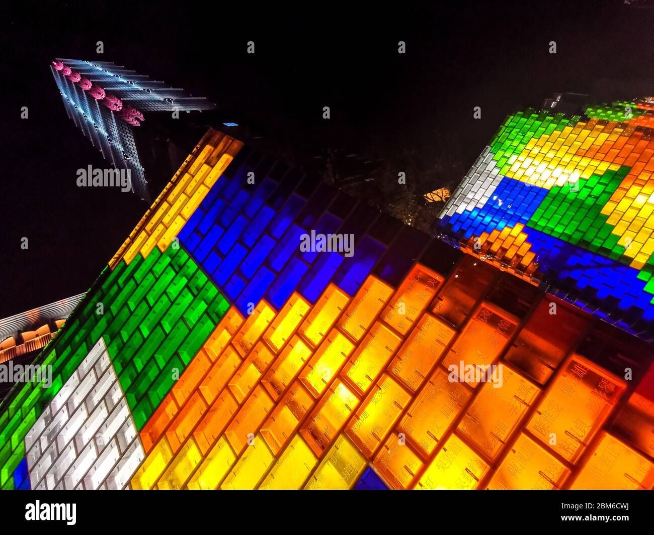 City of neon brick looking lights in yellow orange blue green white in ...