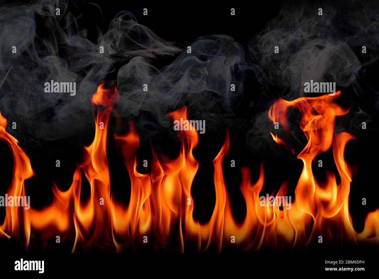 Fire flames with smoke on black background, Burning red hot sparks rise ...