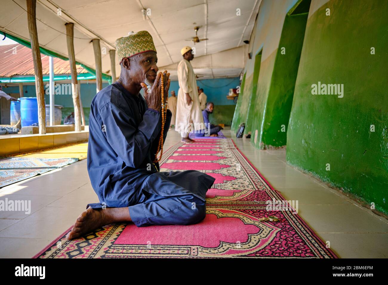 Muslim man praying in a mosque Stock Photo - Alamy
