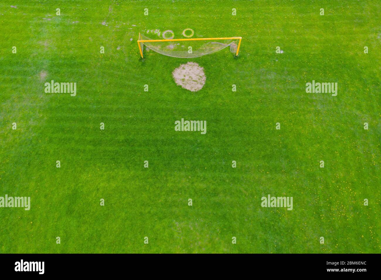 Football net on the background of a green football field. Aerial view ...