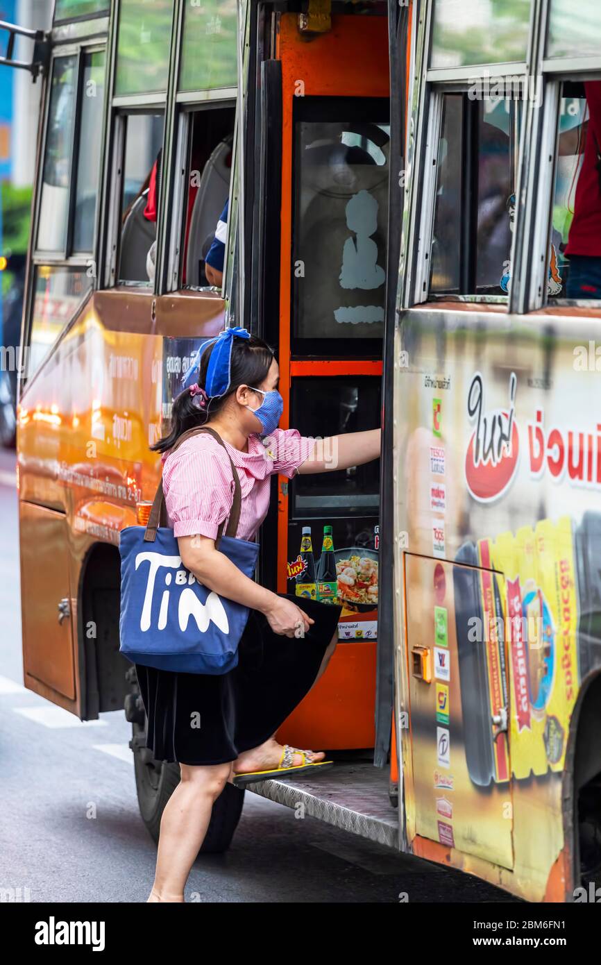 Passenger with face mask boarding bus during Covid 19 pandemic, Bangkok ...