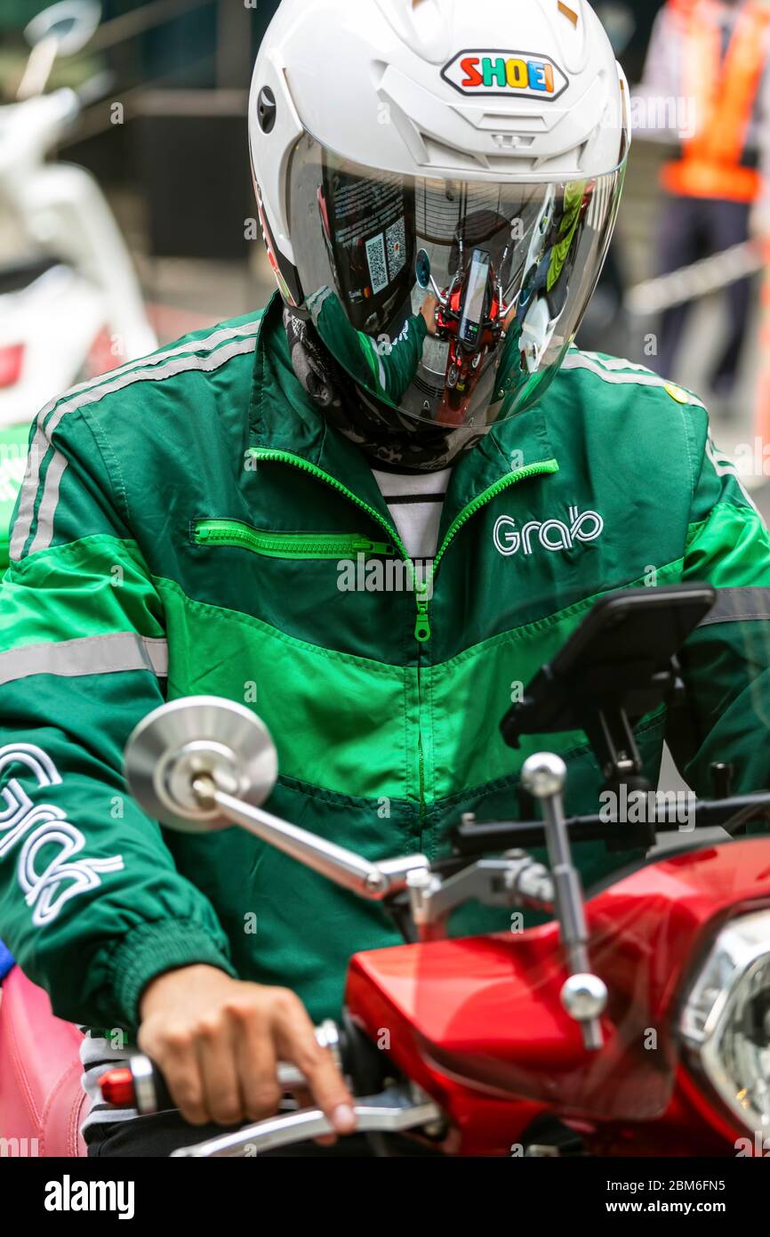 Grab motorcycle food delivery rider with helmet during Covid 19 ...