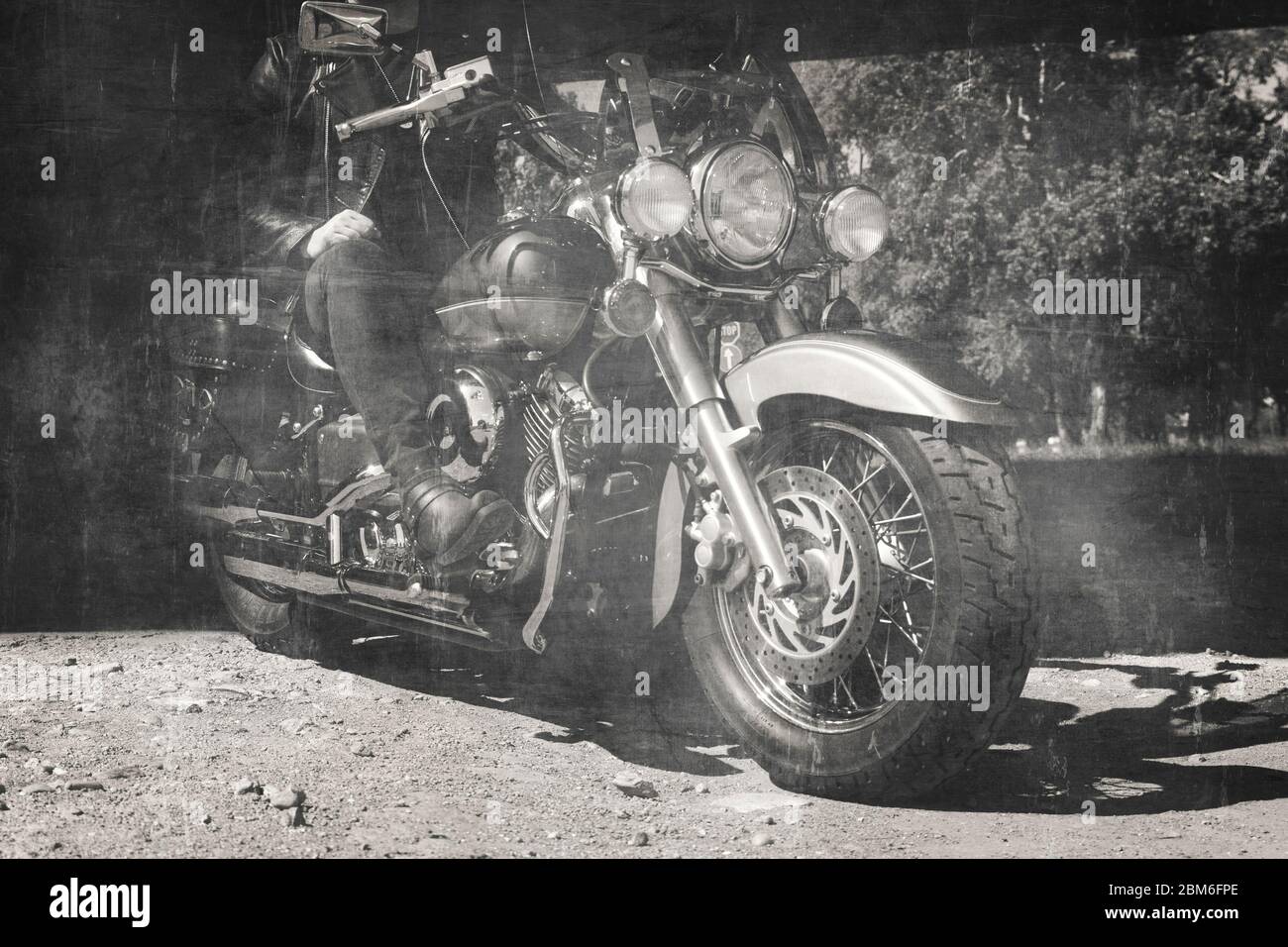Biker riding a motorcycle. View of Bike and legs in leather cowboy ...