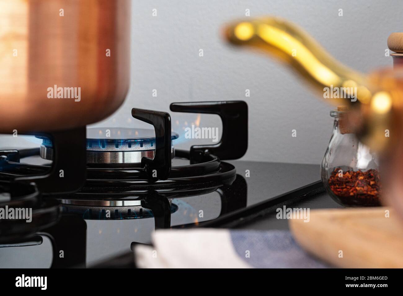 Burning gas stove burner in a kitchen Stock Photo - Alamy