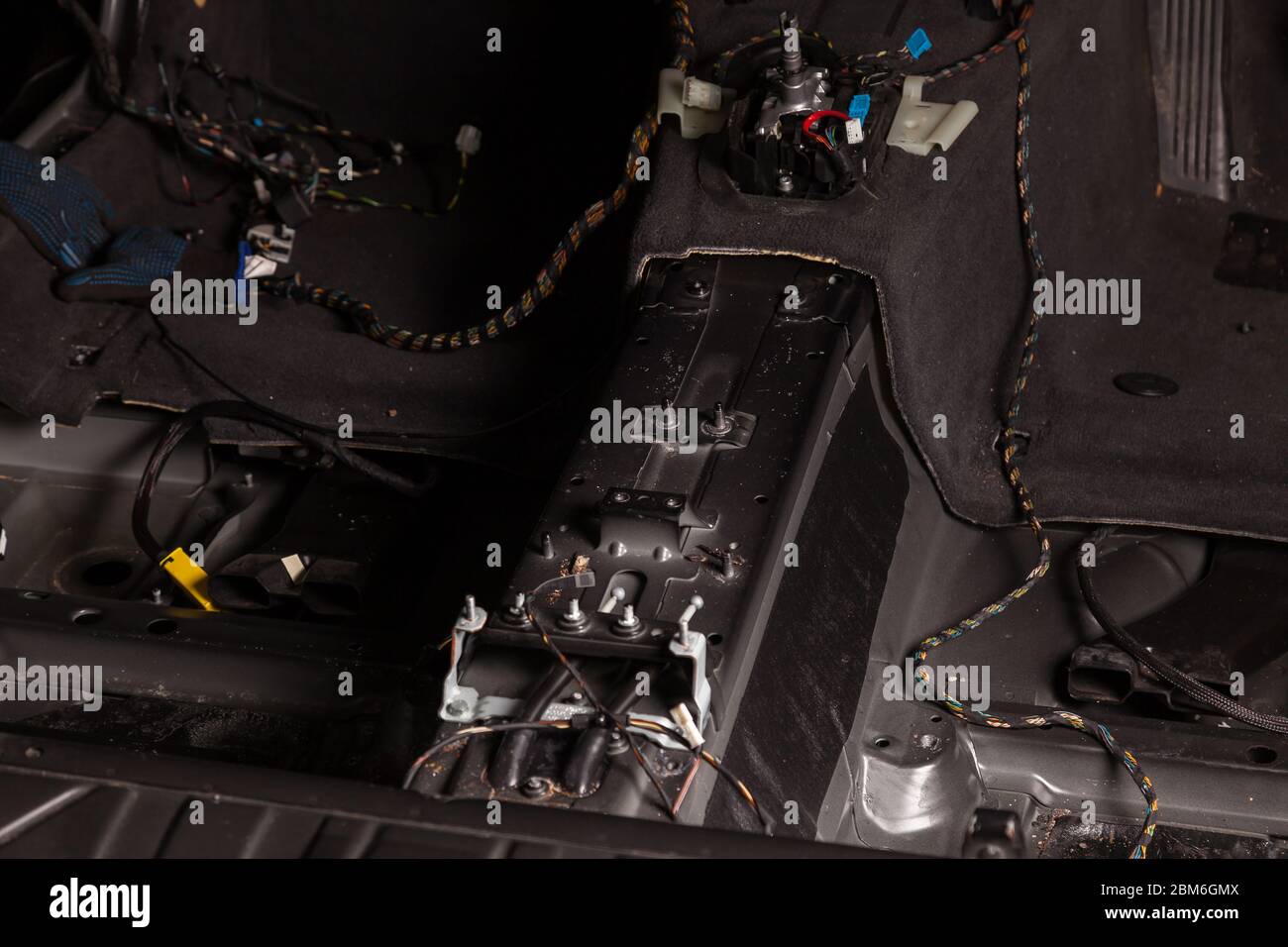 Car interior in the back of a sedan with a disassembled dashboard and ...