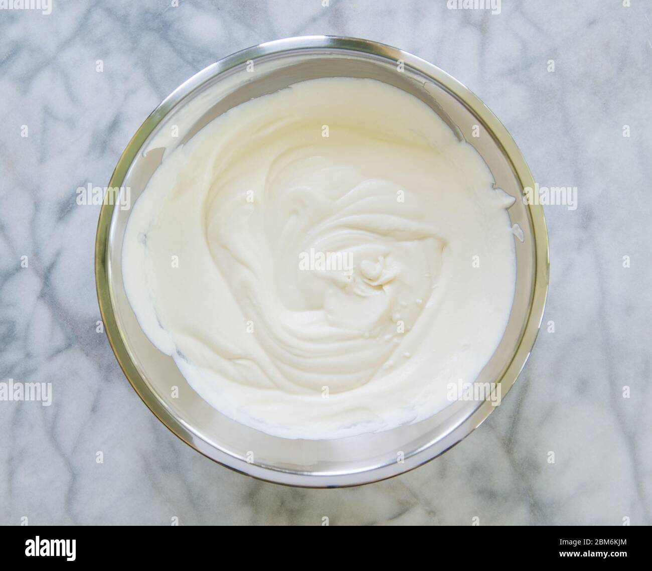 Bowl of cream Stock Photo - Alamy