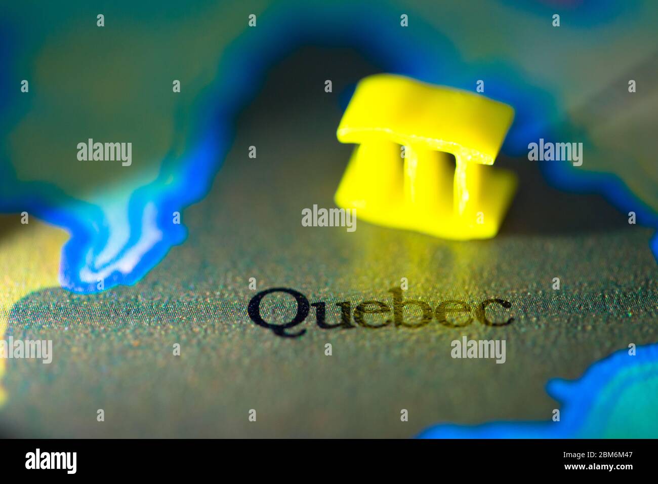 Shallow depth of field focus on geographical map location of Quebec in ...
