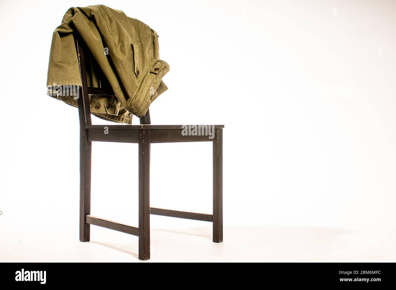 Clothes draped on chair hi-res stock photography and images - Alamy