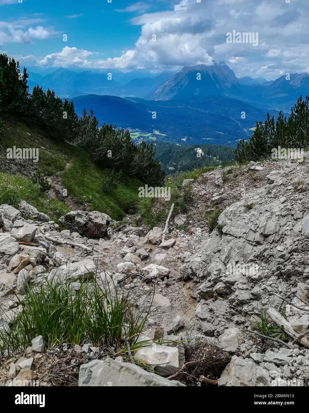 Dramatic vintage view of difficult rocky trekking trail to the mountain ...