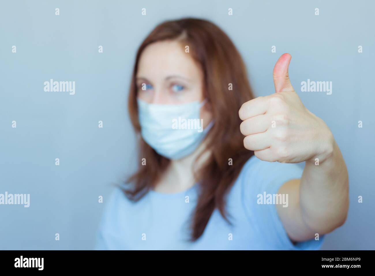 Thumb up with mask hi-res stock photography and images - Alamy