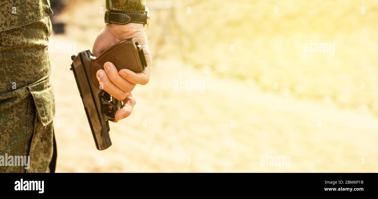 Mans hand holding gun hi-res stock photography and images - Alamy