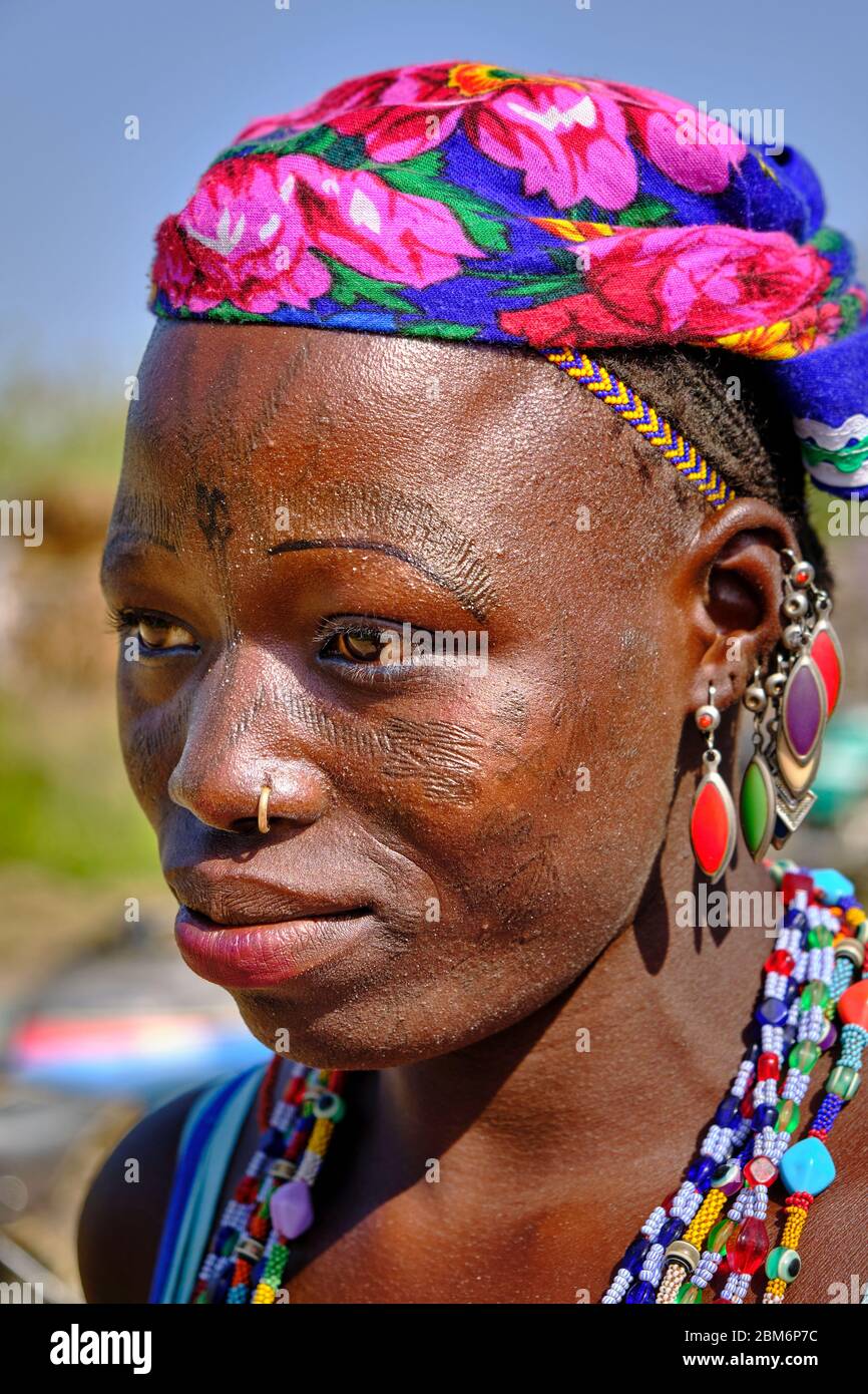 Portrait of a Kamberi woman with facial tattoos and scarifications ...
