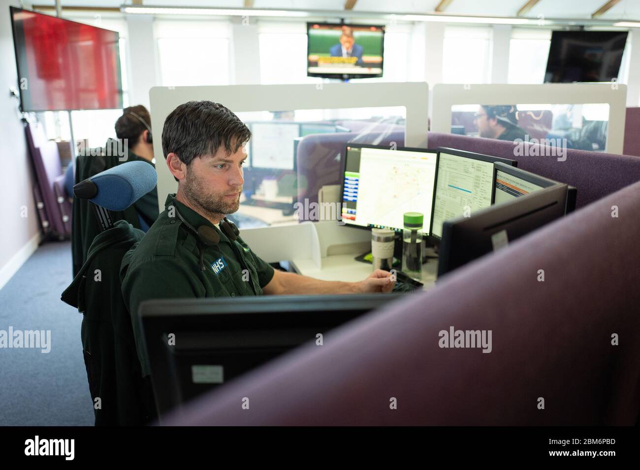 A South Central Ambulance Service dispatch team member assigns a job to ...