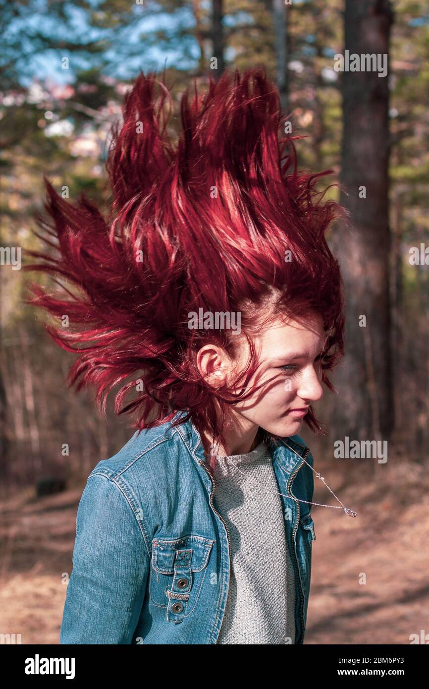 Stop-frame throwing back hair. Young girl with red hair stopped ...