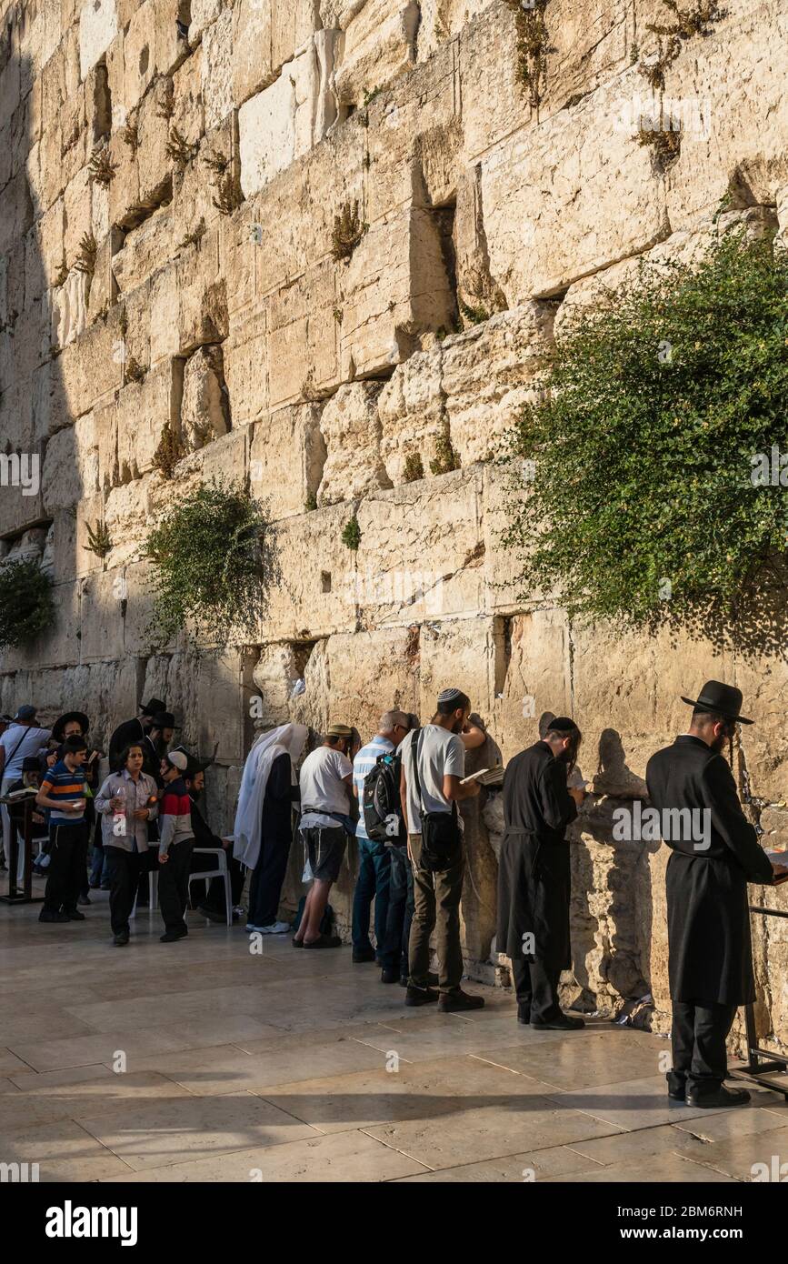 Israel, Jerusalem, Western Wall, A group of Jewish men and boys worship ...