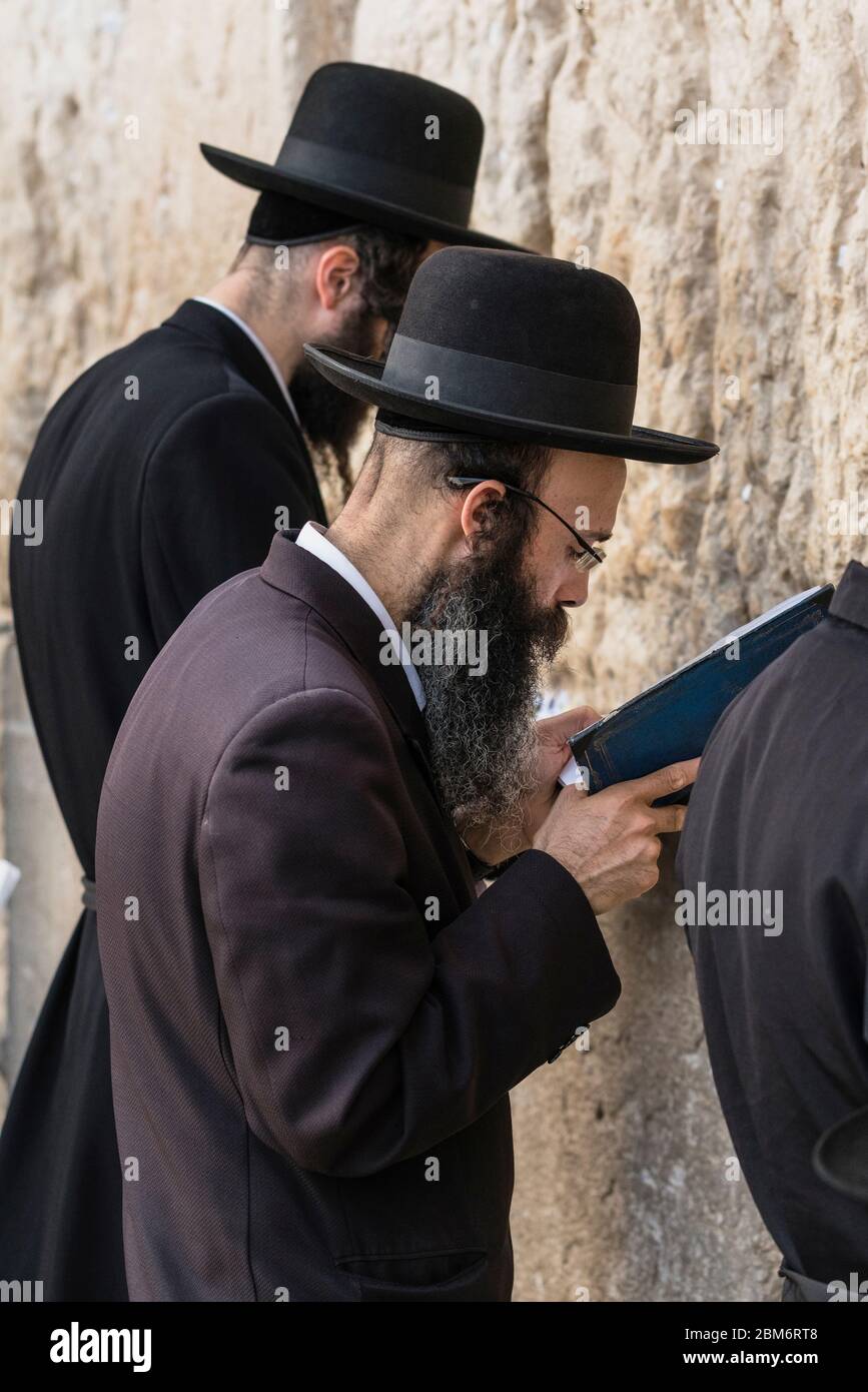 Israel, Jerusalem, Western Wall, Jewish men worship at the Western Wall ...