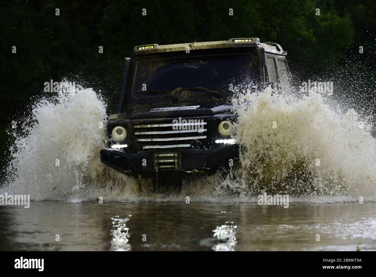 Drag racing car burns rubber. Extreme. Mudding is off-roading through ...