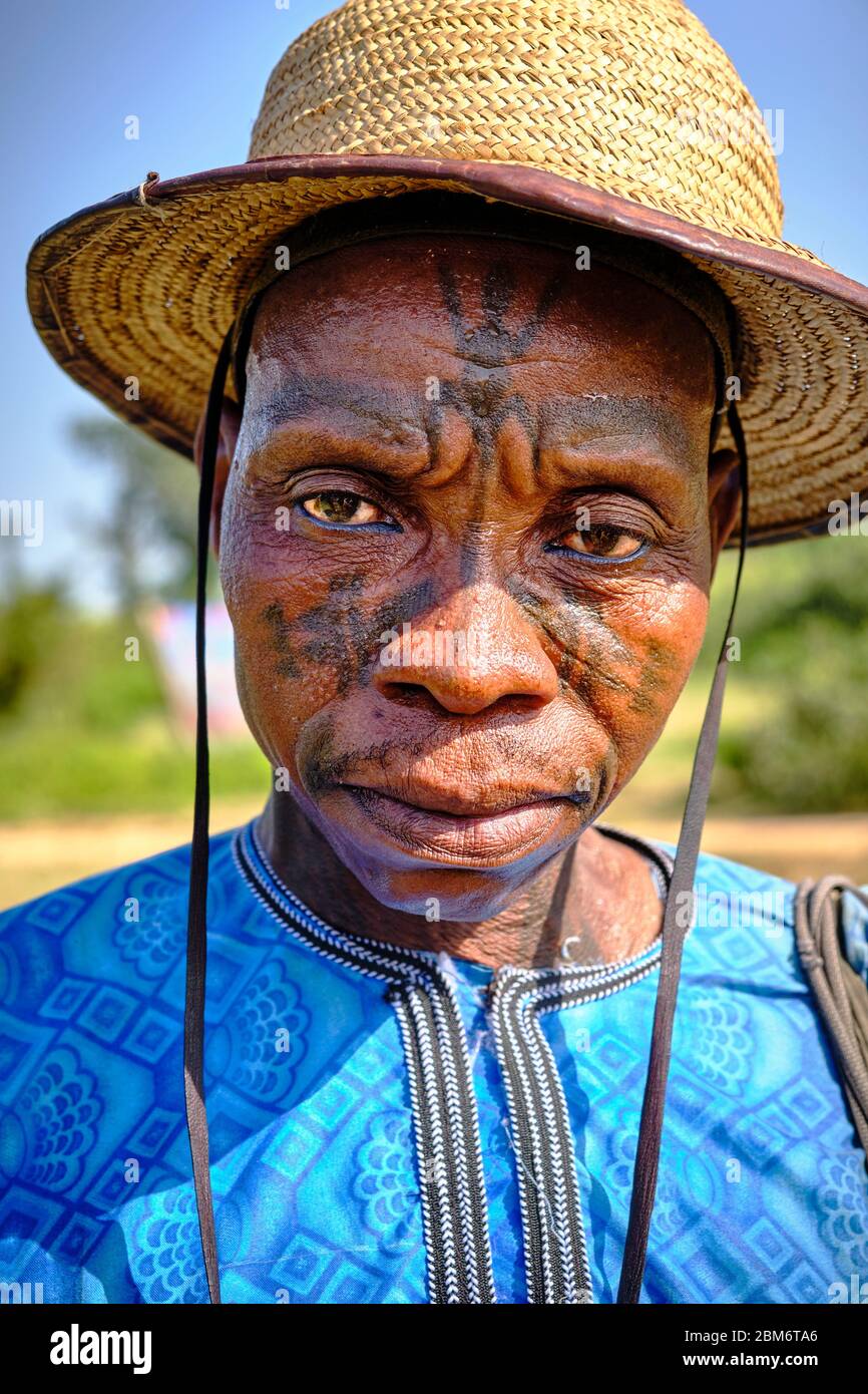 Portrait of a fulani man with facial tattoos and a hat Stock Photo - Alamy