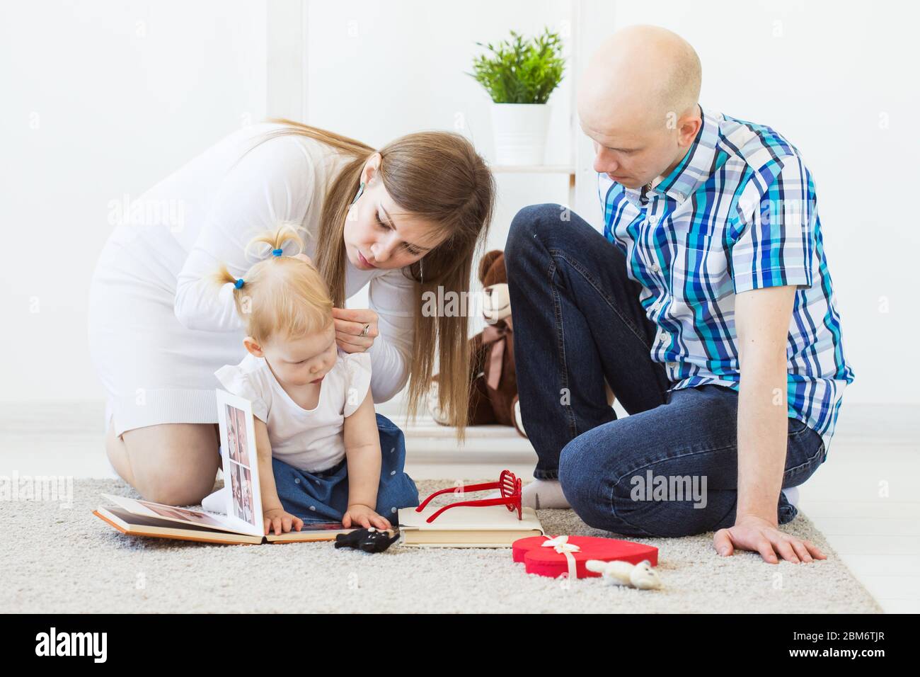 Baby girl wearing a hearing aid. Disabled child, disability and ...