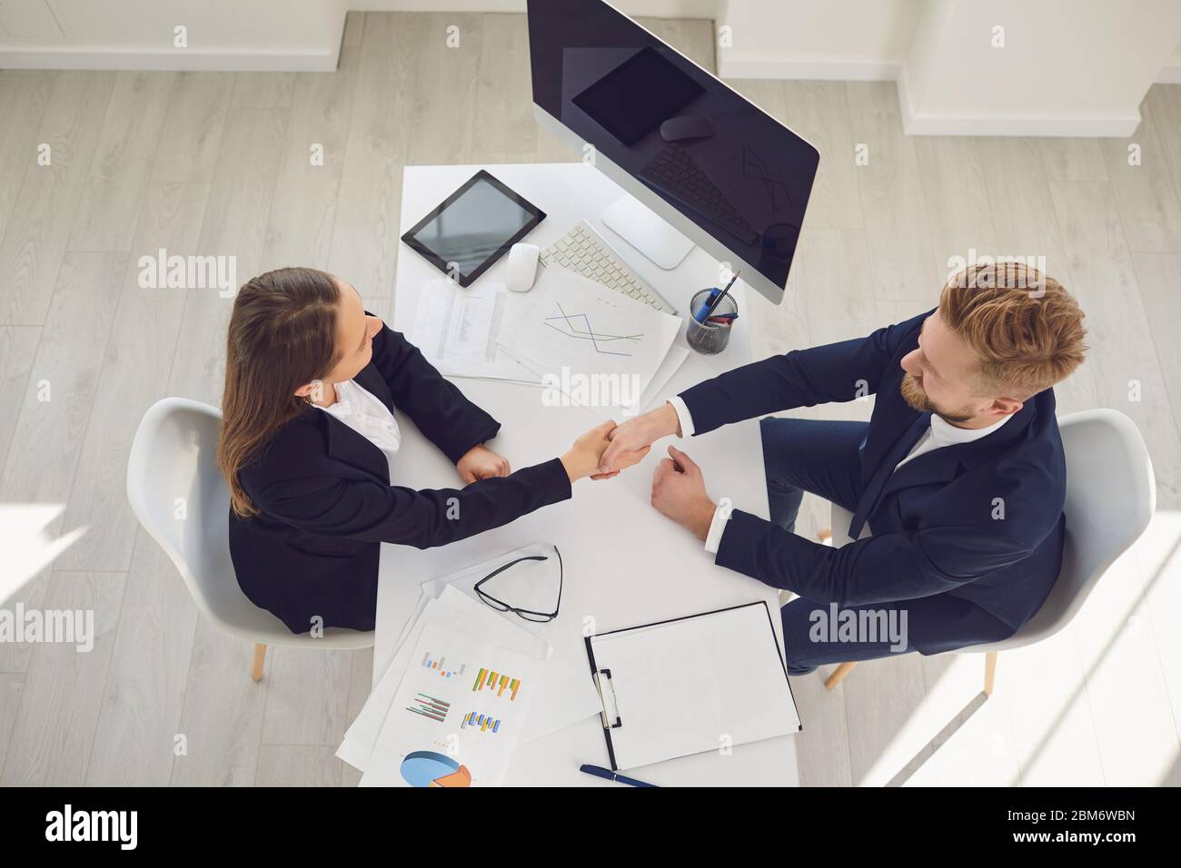 Successful interview. Handshake of businessmen recruiters at the table ...