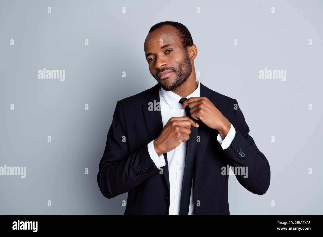 African business man fixing his tie hi-res stock photography and images ...
