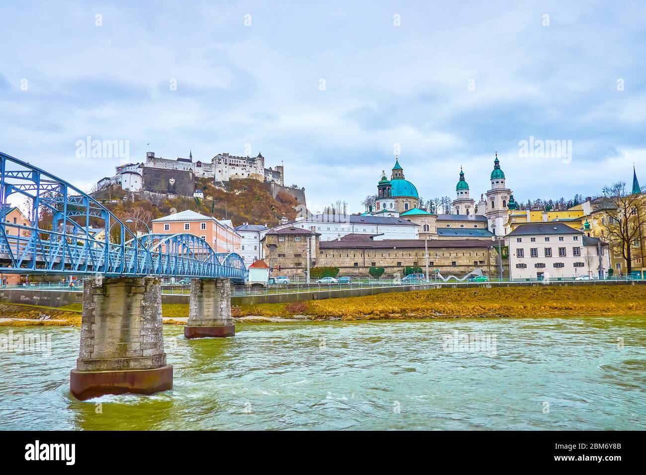 The metal Mozartsteg footbridge over Salzach river in central district ...