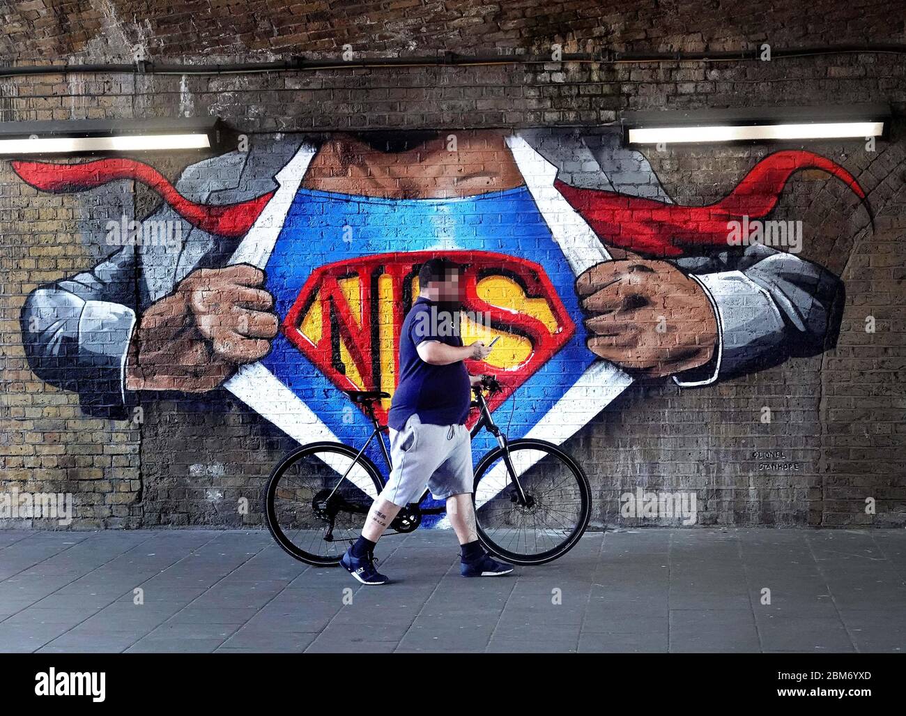 7.5.20 NHS Superman mural in Waterloo London large man with bicycle ...
