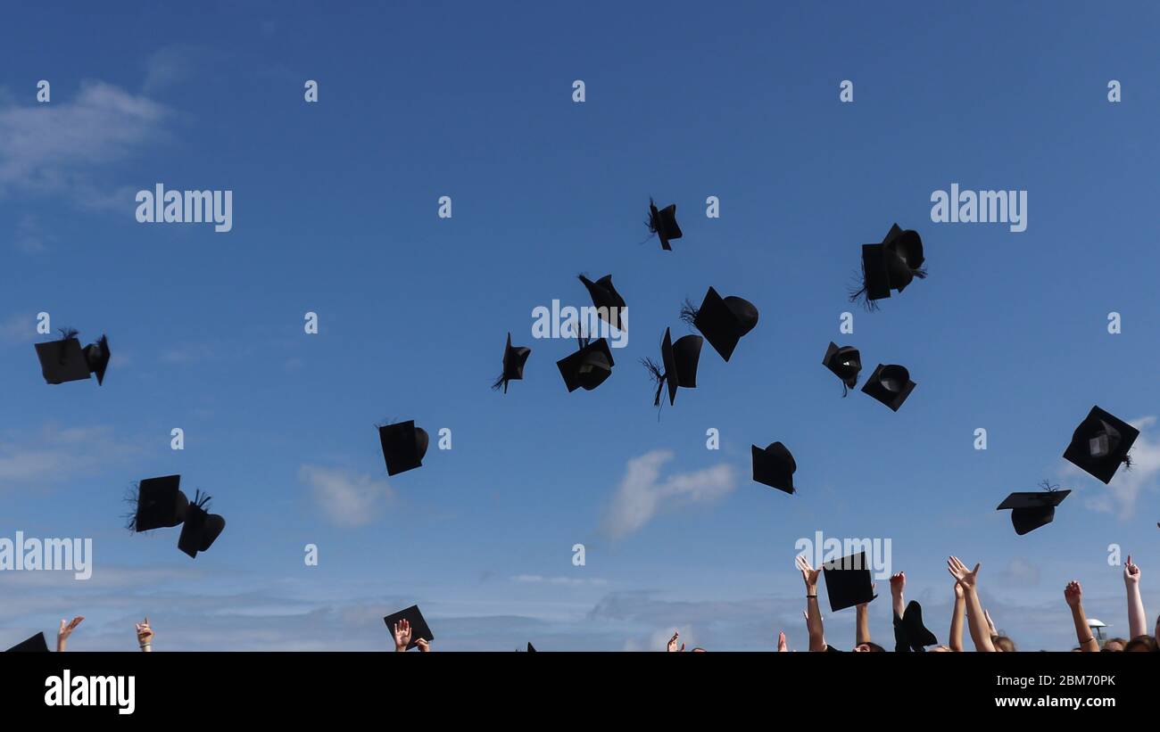 Graduates throwing caps in hi-res stock photography and images - Alamy