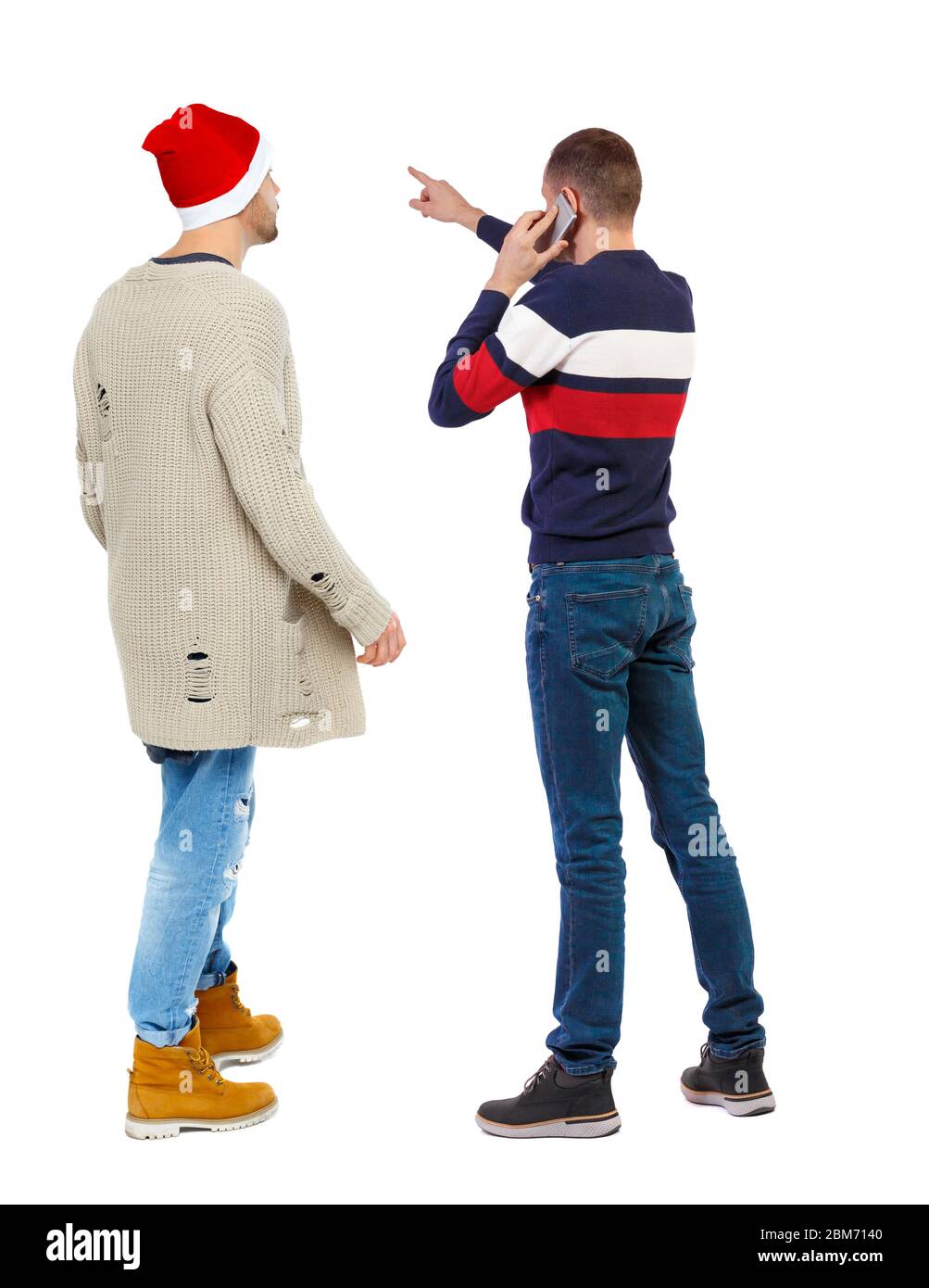 Back view of two man in sweater with mobile phone. Rear view people ...