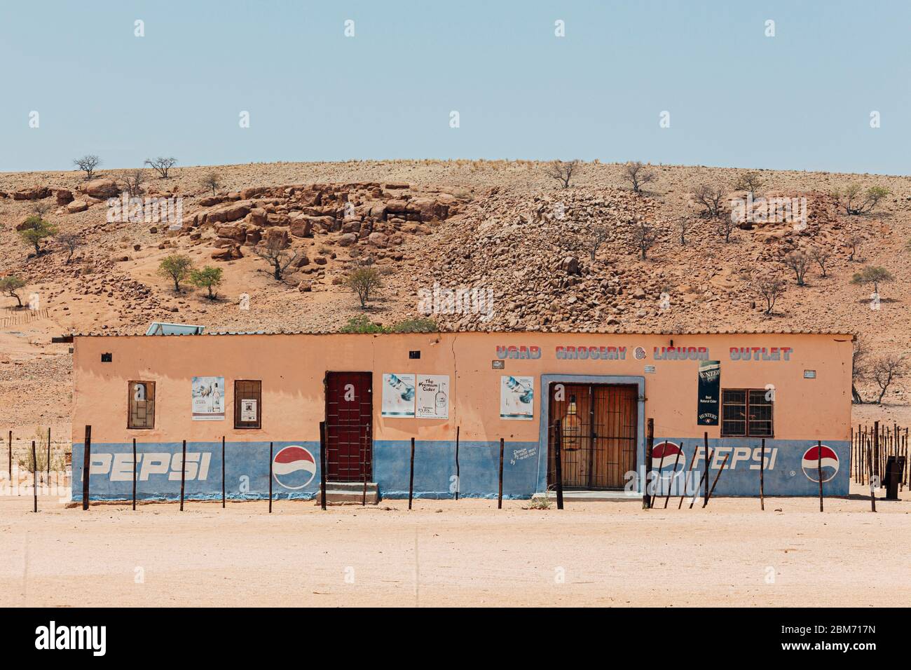 Brightly painted front facade of a shop in the village of Ugab, Namibia ...