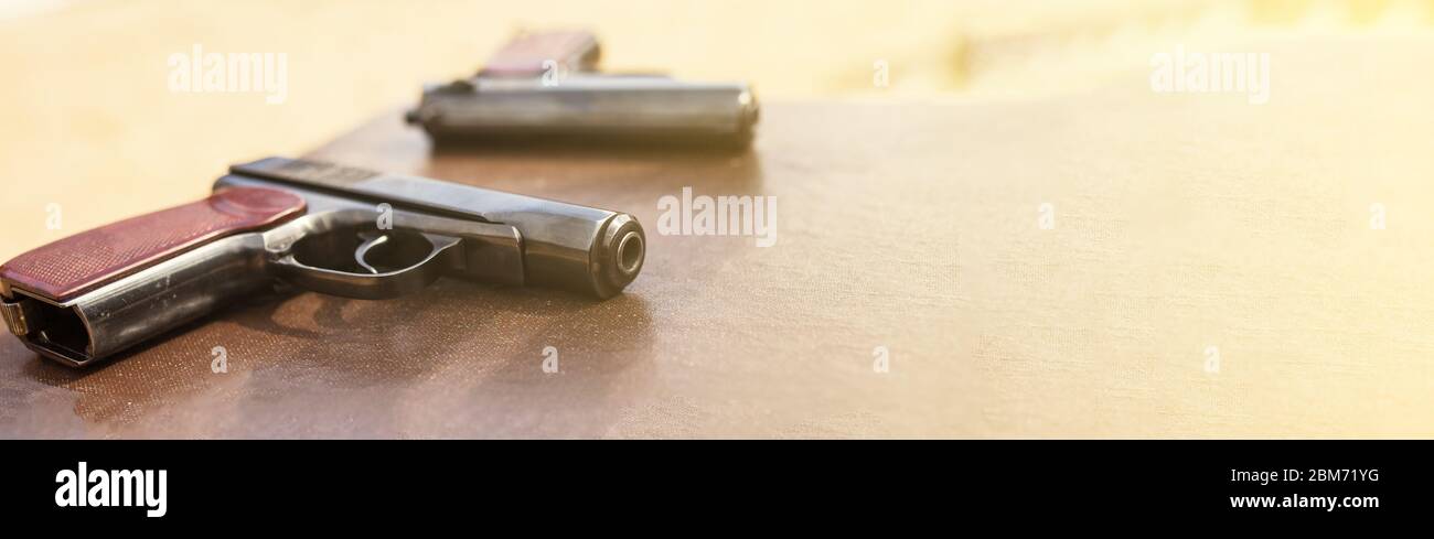 The gun lies on a table on old village boards, legalization of weapons ...