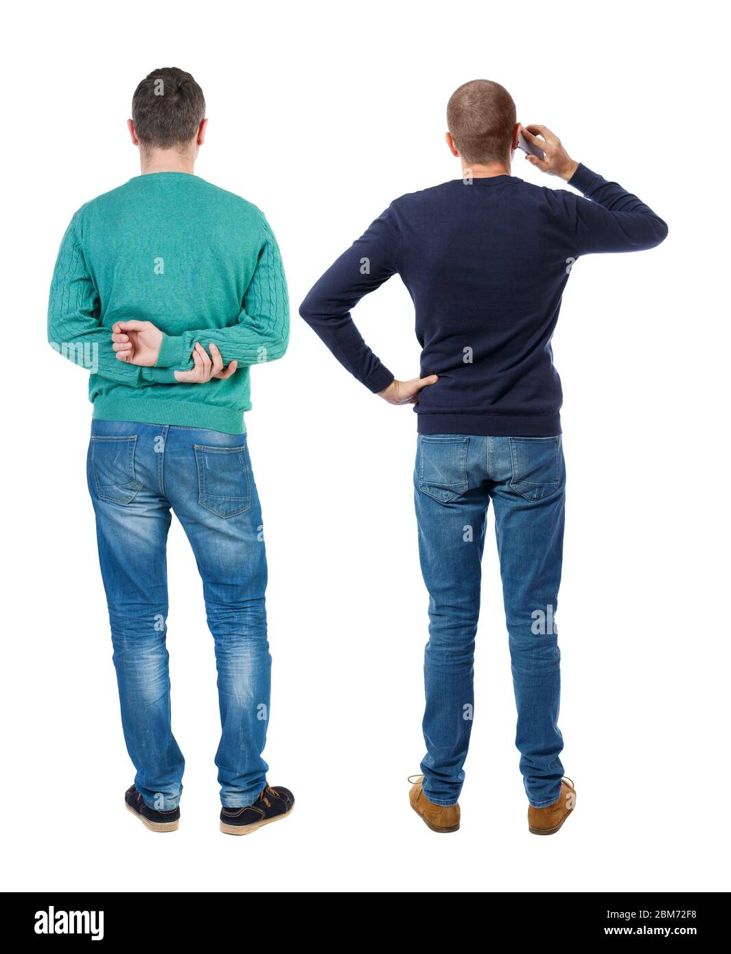 Back view of two man in sweater with mobile phone. Rear view people ...