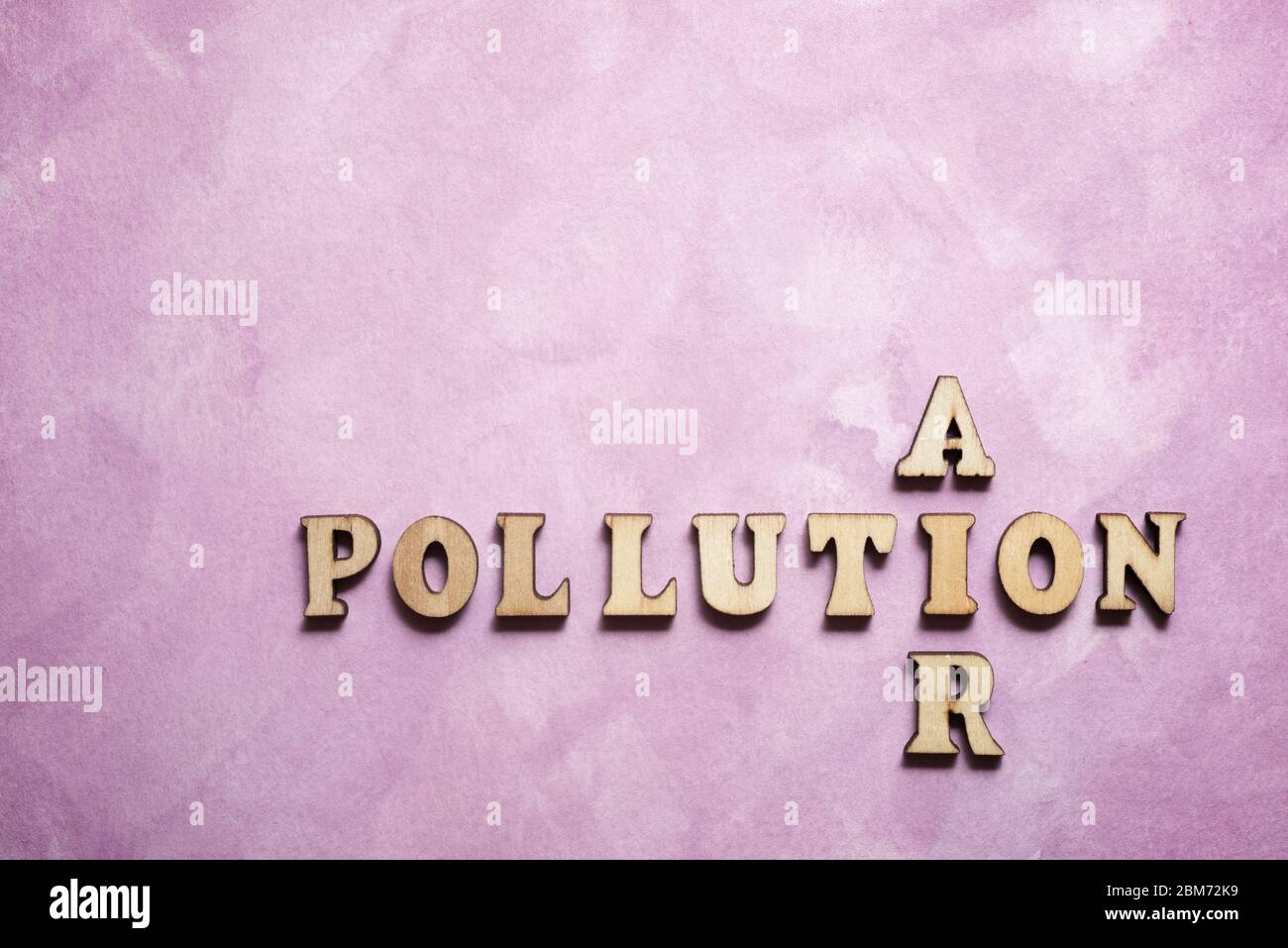 Air pollution text on a colored paper Stock Photo - Alamy