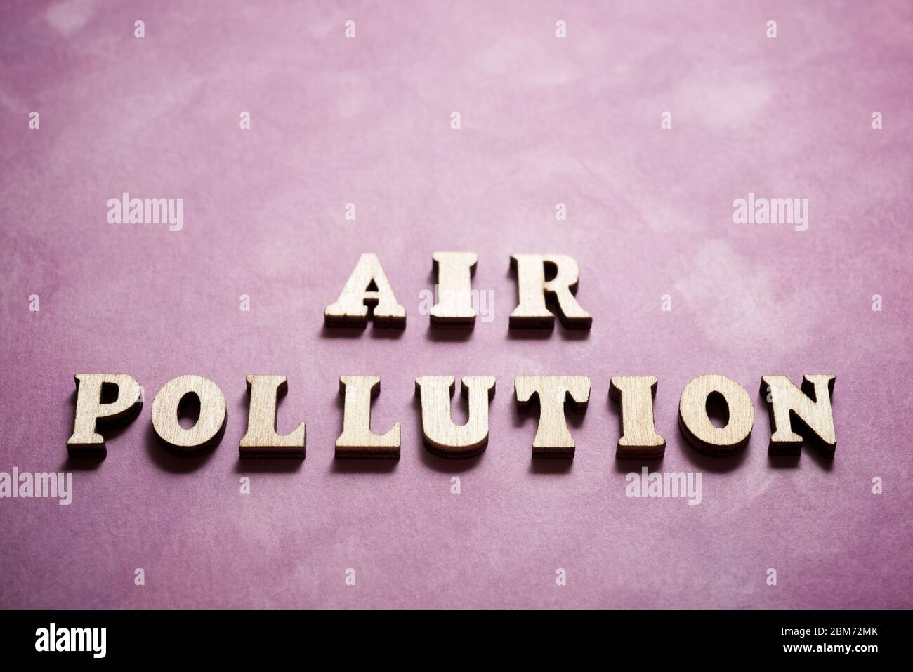 Air pollution text on a colored paper Stock Photo - Alamy