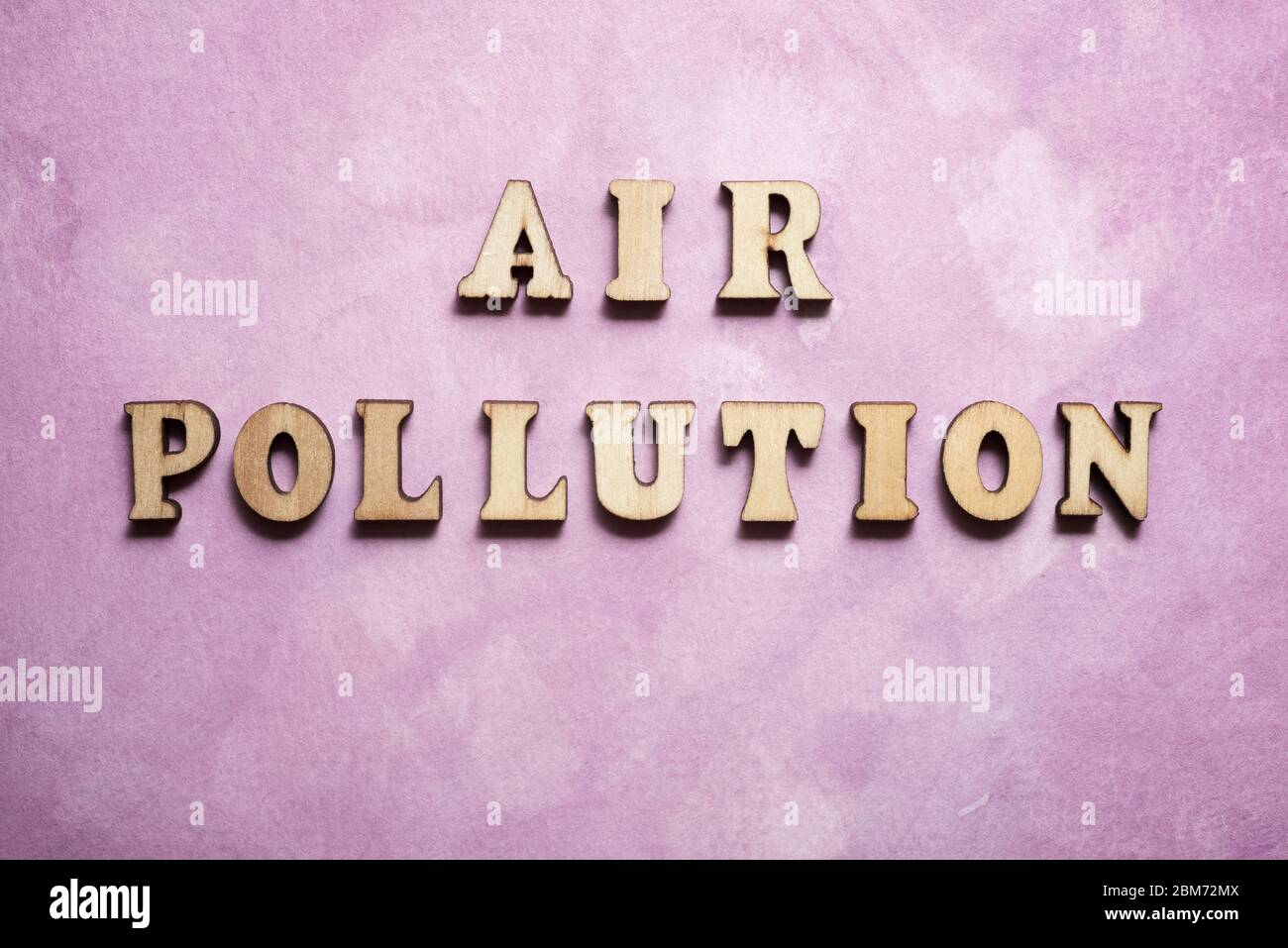 Air pollution text on a colored paper Stock Photo - Alamy