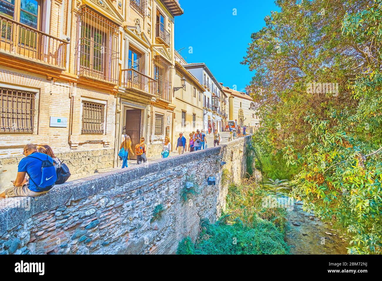 GRANADA, SPAIN - SEPTEMBER 25, 2019: Walk the medieval stone embankment ...