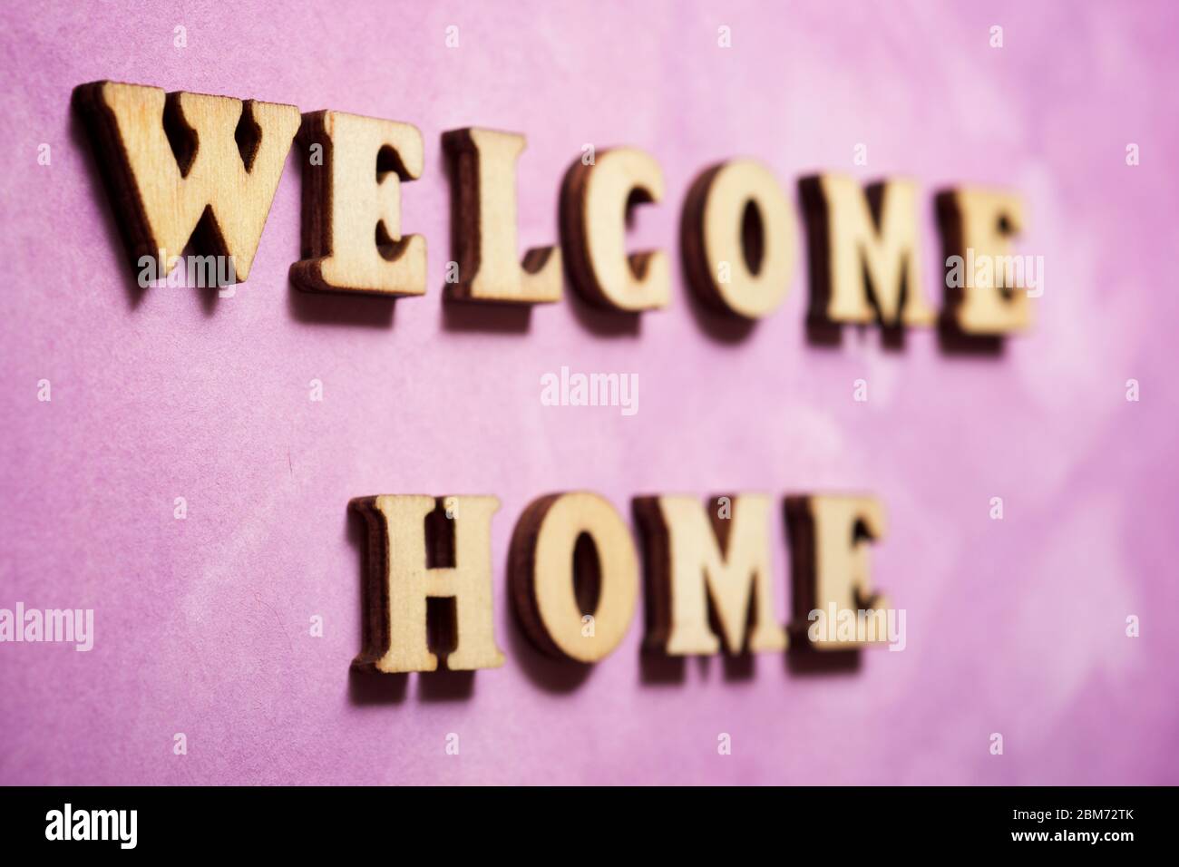Welcome Home text on a colored paper Stock Photo - Alamy