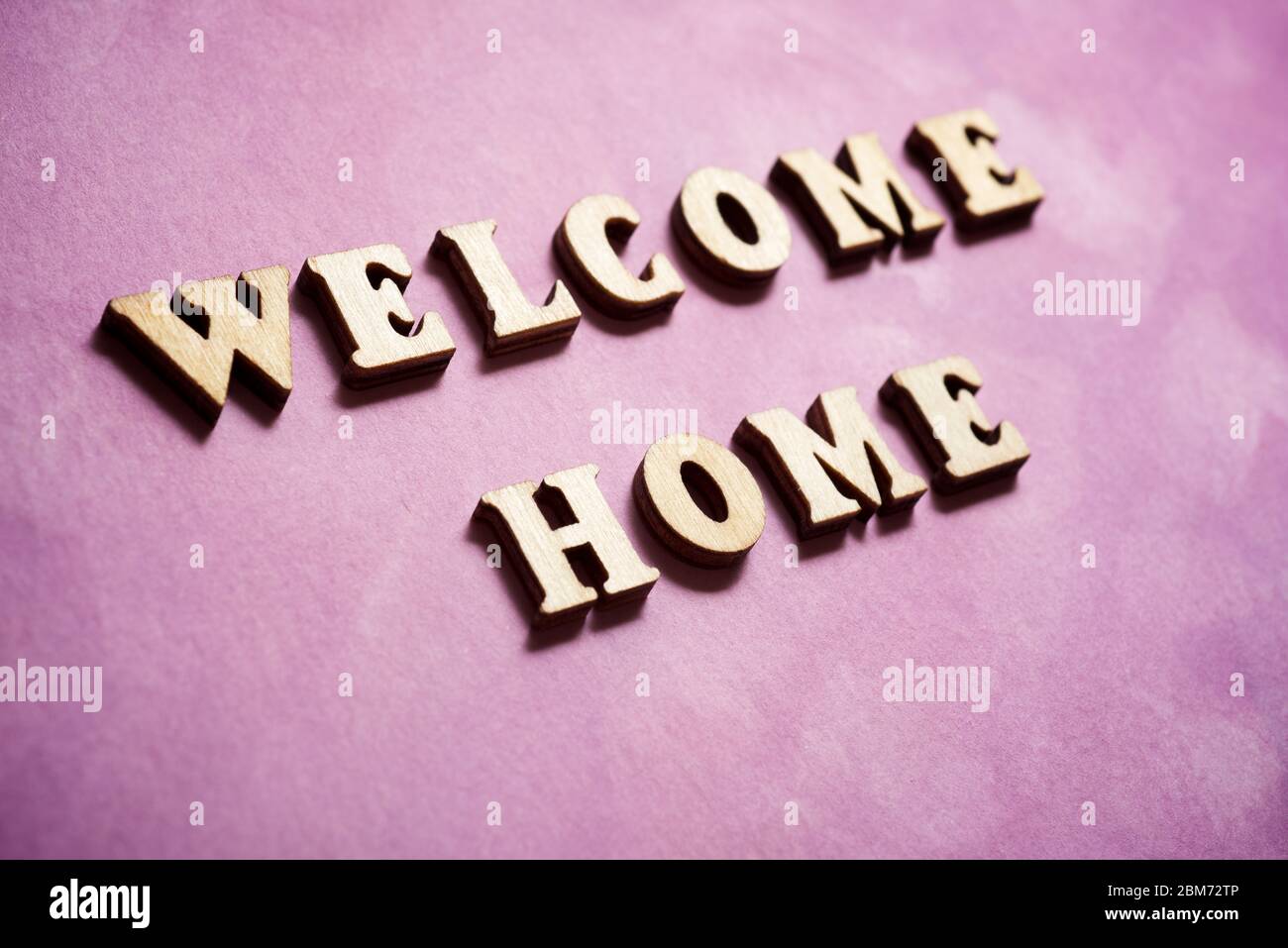 Welcome Home text on a colored paper Stock Photo - Alamy