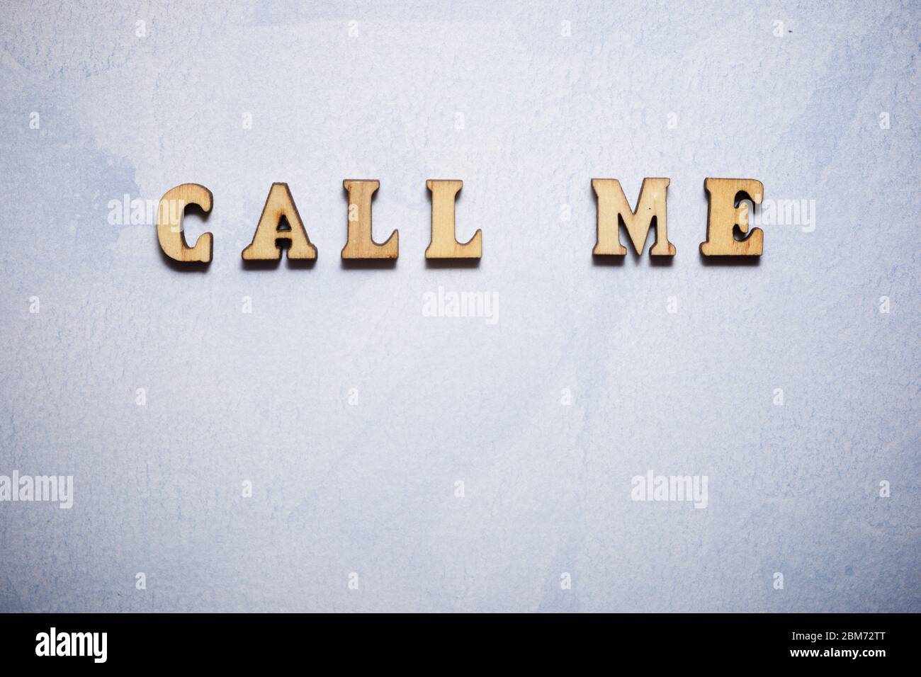 Call me text in a colored paper Stock Photo - Alamy