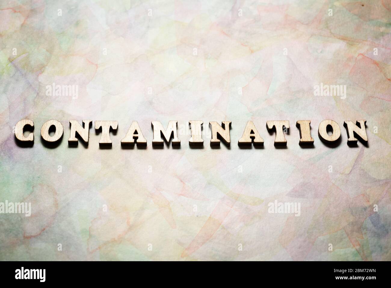 Contamination text in a colored paper Stock Photo - Alamy