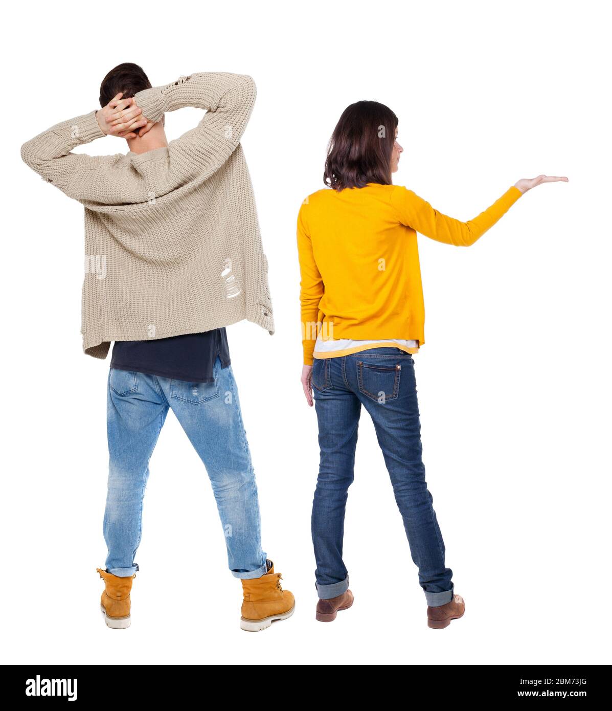 Back view of couple in sweater pointing. Rear view people collection ...